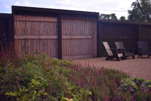 Practice Landscape Converts a Barn Into a Walled Garden in the Midwest